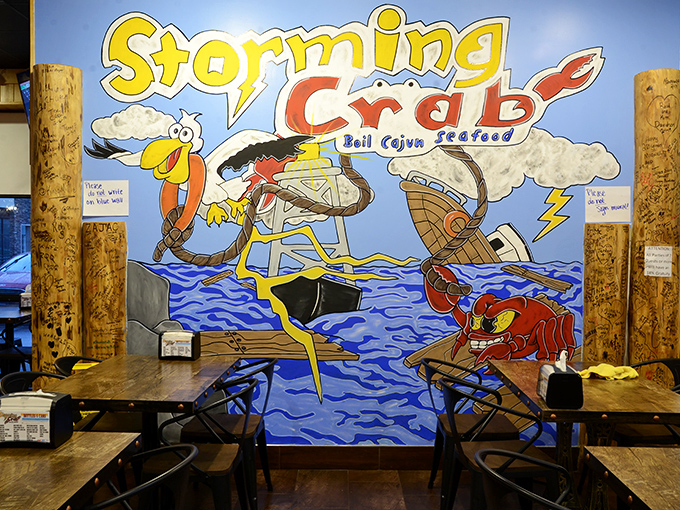 The whimsical mural tells the Storming Crab story – where cartoon sea creatures seem suspiciously happy about their delicious destiny.