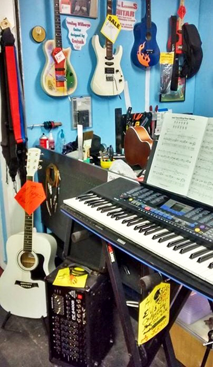 Musical dreams hang on blue walls, waiting for their next gig. That keyboard has probably played "Piano Man" more times than Billy Joel.