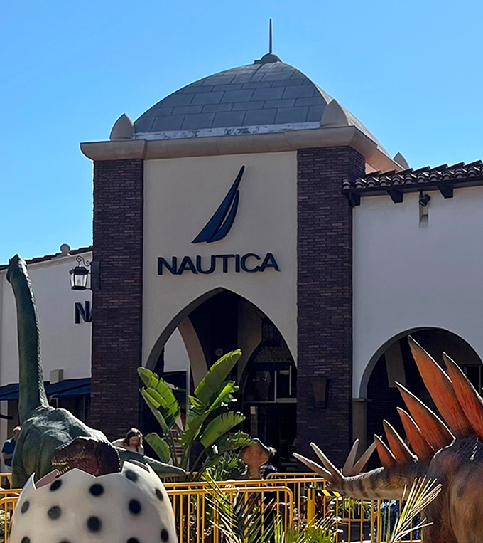 Nautica brings nautical vibes to this inland shopping experience, complete with what appears to be prehistoric visitors enjoying the scenery.