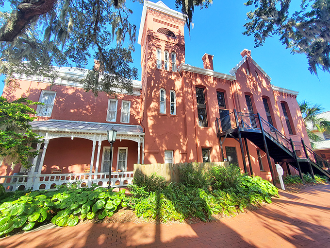 The Old Jail's salmon-colored façade belies its serious past – architectural misdirection that once fooled visitors into thinking it was just another hotel.