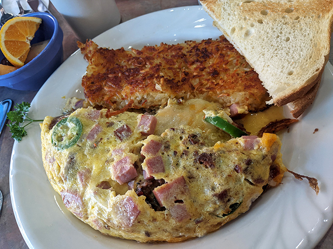 An omelet that's achieved that elusive perfect fold&mdash;stuffed with ham and veggies in a delicate egg embrace that's both hearty and refined.
