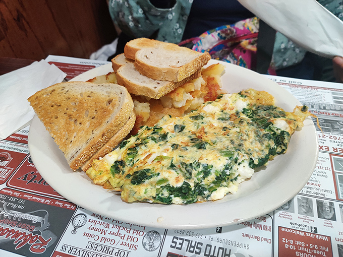 A spinach and cheese omelet that's perfectly executed&mdash;fluffy, not rubbery&mdash;with a side of home fries that puts fast-food breakfast to shame.