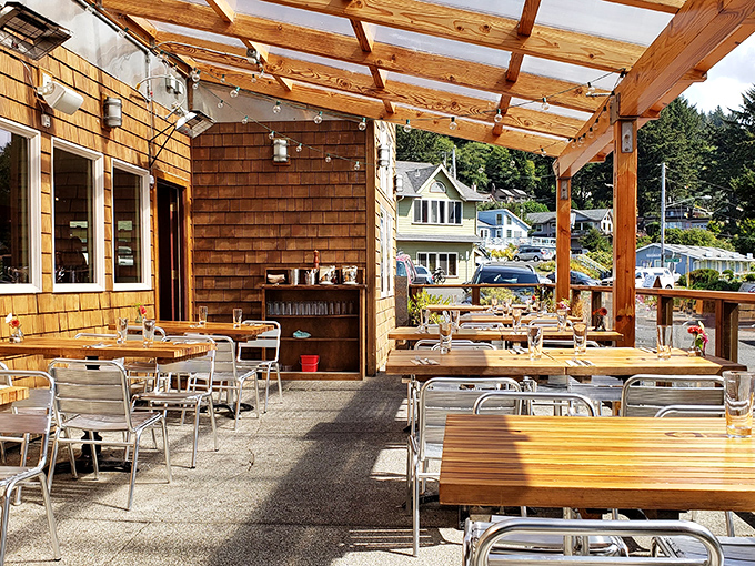 Ona's outdoor dining area doesn't just offer meals—it offers memories, with wooden tables bathed in coastal light and ocean breezes.
