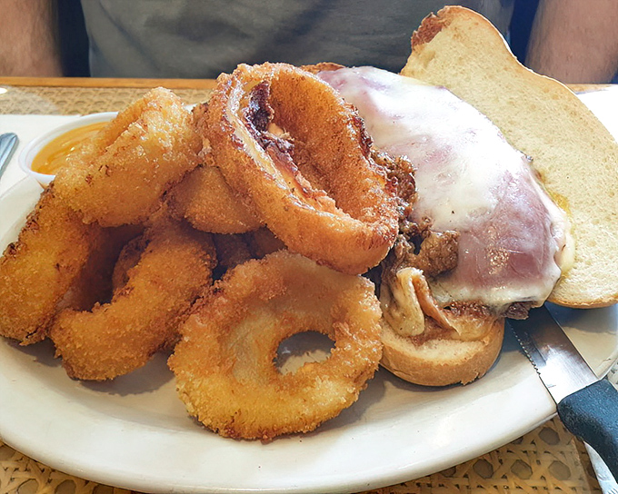 This sandwich with onion rings isn't just lunch&mdash;it's an engineering marvel where crunch meets melt in a symphony of textures.
