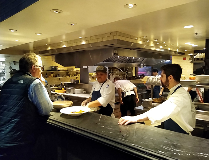 The open kitchen &ndash; where culinary magic happens without smoke and mirrors, just skilled hands transforming ocean treasures into edible art.