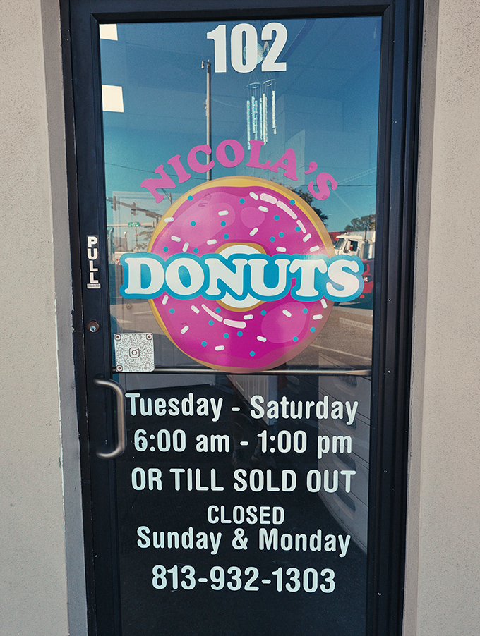 The door tells the truth: arrive early or face the consequences. "Till sold out" isn't a suggestion&mdash;it's a daily reality for donut devotees.