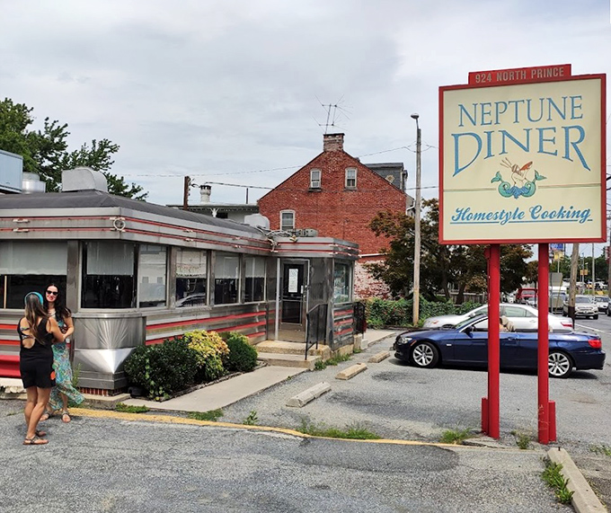 Neptune Diner's exterior and iconic sign stand as a beacon of hope for the hungry traveler seeking authentic Pennsylvania comfort food.
