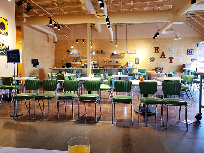 An interior designed for maximum breakfast enjoyment. The "EAT" sign on the wall is both instruction and invitation.