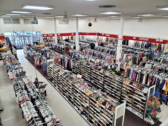 A bird's-eye view of organized chaos. The red signs marking departments serve as beacons in this sea of secondhand treasures.