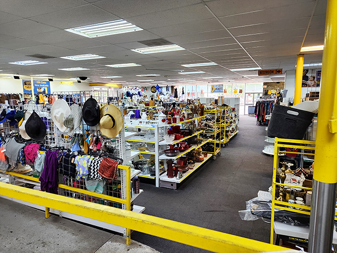 A thrifter's panorama of possibility. Those hanging hats aren't just accessories&mdash;they're identities waiting to be borrowed or reinvented.