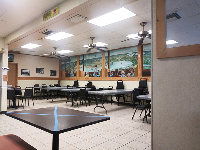 The dining room's simple charm comes from decades of serving honest food rather than chasing Instagram trends. Those ceiling fans have stories to tell.