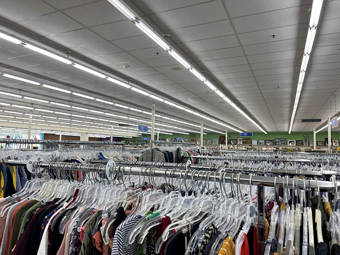 The clothing section stretches toward the horizon like a textile ocean, each hanger a potential fashion revelation waiting to be discovered.