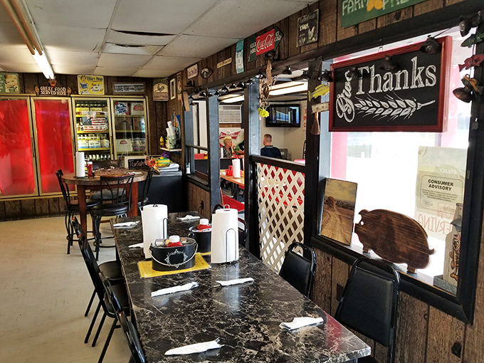 Wood paneling, vintage signs, and a chalkboard menu create the kind of authentic atmosphere corporate chains spend millions trying to replicate.