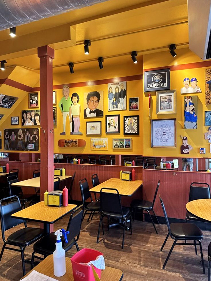 Yellow walls adorned with quirky art create the perfect backdrop for hot dog enlightenment. Every table offers a different visual feast. 