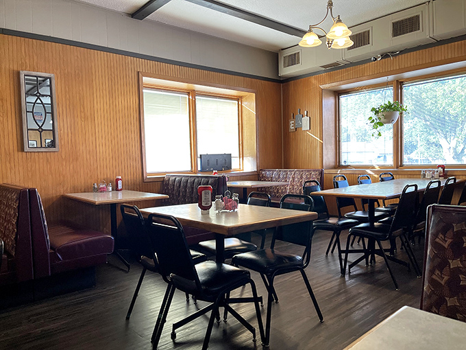 Wood paneling, booth seating, and natural light streaming through windows&mdash;Harvey's dining room feels like the community living room where everyone's welcome.