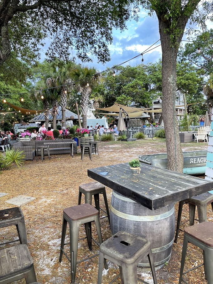 String lights twinkle above outdoor tables nestled among palm trees. Florida dining as it should be&mdash;casual, breezy, and surrounded by nature.
