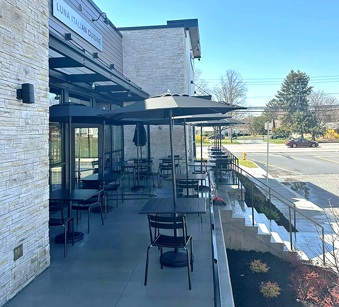 Outdoor seating that transforms ordinary Pennsylvania afternoons into al fresco Italian holidays – just add wine and good company.