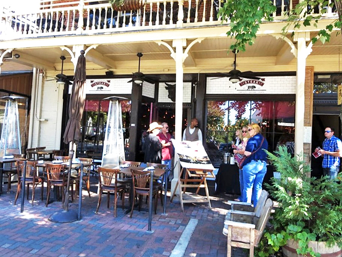 Al fresco dining with Southern charm. The brick patio under the historic balcony offers the perfect setting for people-watching while savoring your carnivorous delights.
