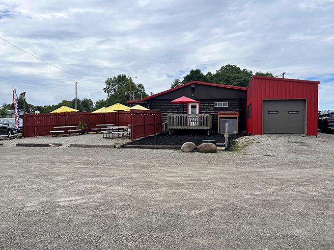 The outdoor seating area with bright yellow umbrellas is where summer barbecue memories are made. Those picnic tables have witnessed countless sauce-stained smiles.