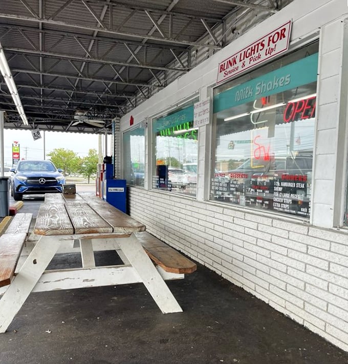 Outdoor picnic tables offer al fresco dining with a side of people-watching, perfect for those summer evenings when eating indoors feels like culinary sacrilege.