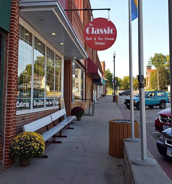 Outside, simple benches invite you to sit and contemplate your next visit while yellow mums add a touch of sunshine even on cloudy days.