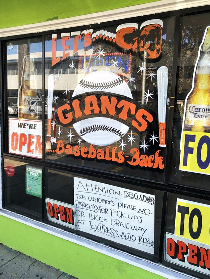 The hand-painted window announces Giants baseball season&mdash;because great tacos and hometown pride go together like chips and salsa.