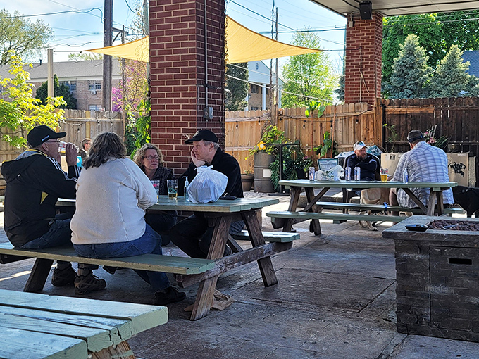 The outdoor seating area where strangers become friends, united by the universal language of "mmm" and "pass the napkins, please."