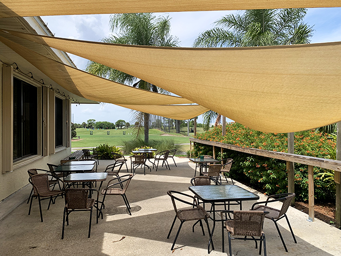 Outdoor seating under sail-like canopies offers al fresco dining with Florida breezes – civilization's answer to the picnic, minus the ants.
