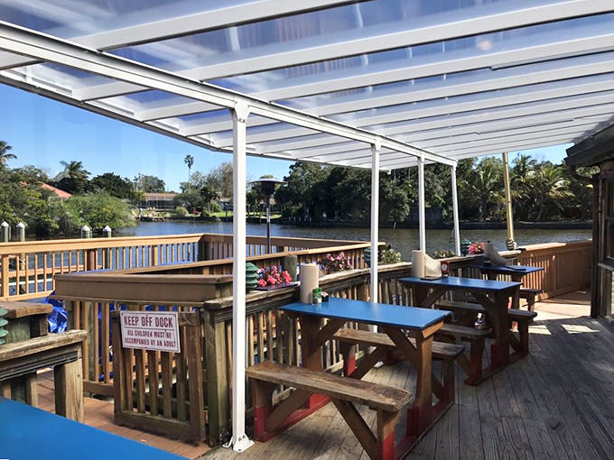 Waterfront dining at its finest. These blue-topped picnic tables offer front-row seats to Phillippi Creek's serene waters&mdash;nature's perfect dinner companion.