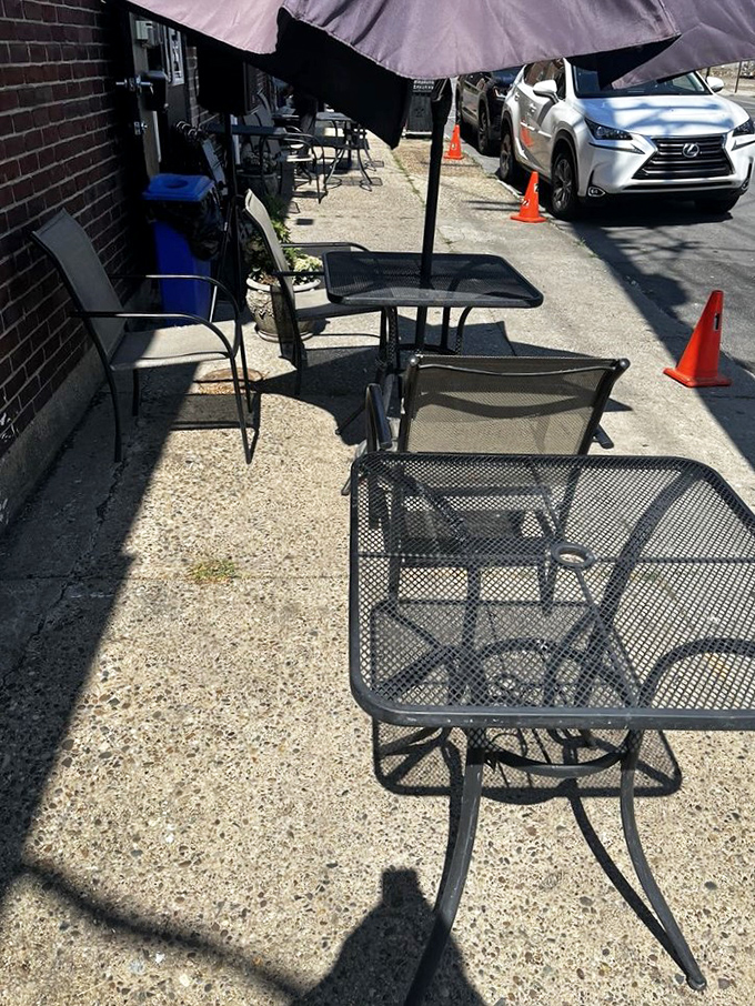 Outdoor seating for when your soul food coma requires fresh air. These simple metal tables have supported countless elbows and satisfied sighs.