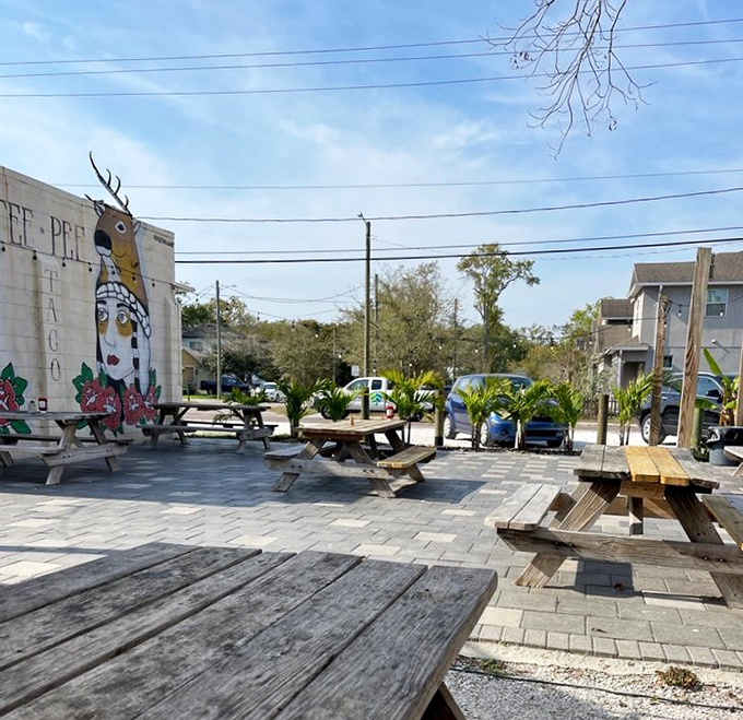 Outdoor seating where the Florida breeze enhances every bite. These picnic tables have witnessed countless seafood epiphanies.