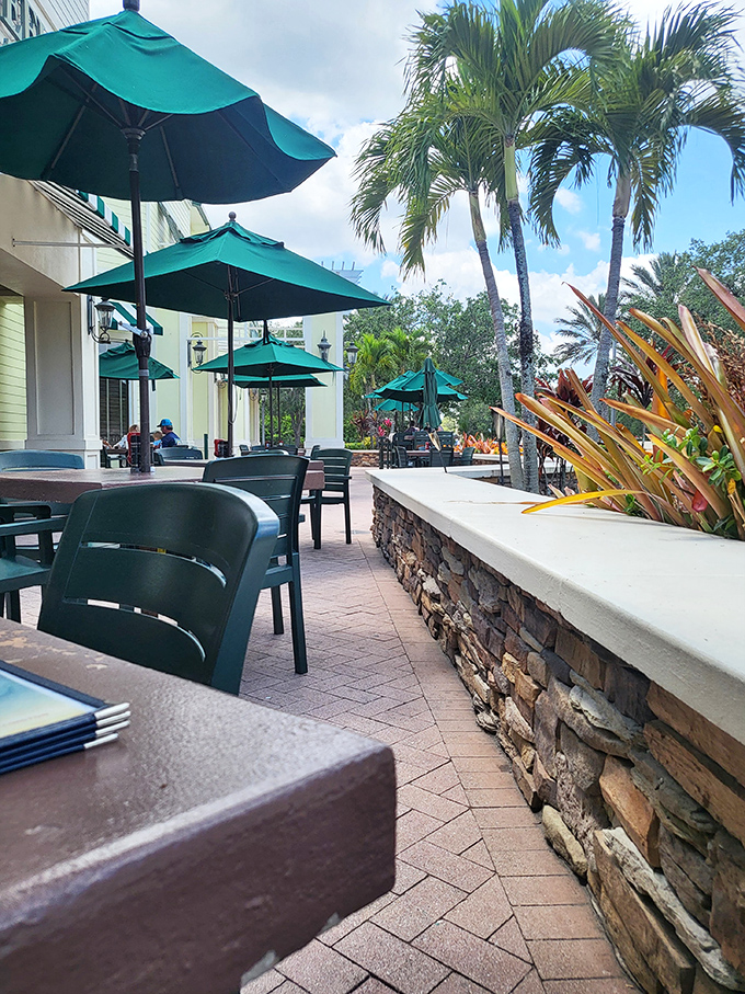 Outdoor serenity just steps from your table. The stone patio with emerald umbrellas offers a peaceful retreat for al fresco dining enthusiasts.