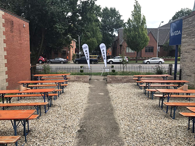 Outdoor seating arranged with German beer garden precision, ready for the symphony of satisfied grunts that accompanies great barbecue.