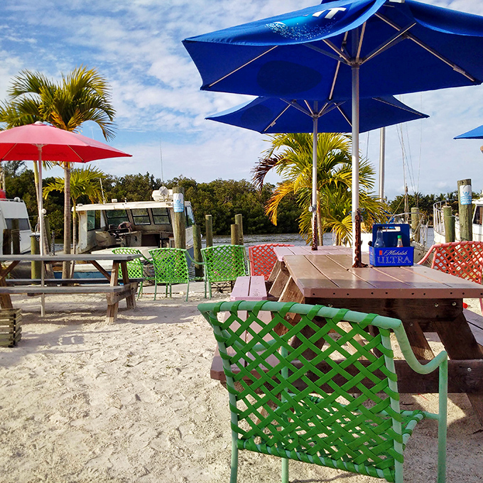 Colorful chairs and umbrellas create the perfect backdrop for seafood feasts with your toes practically in the sand.