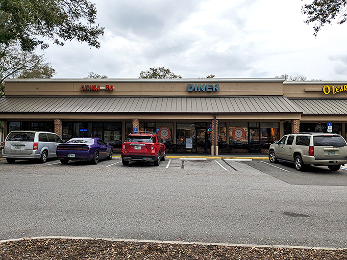 The parking lot view that doesn't prepare you for the flavor explosion waiting inside. Like judging a book by its strip mall cover.