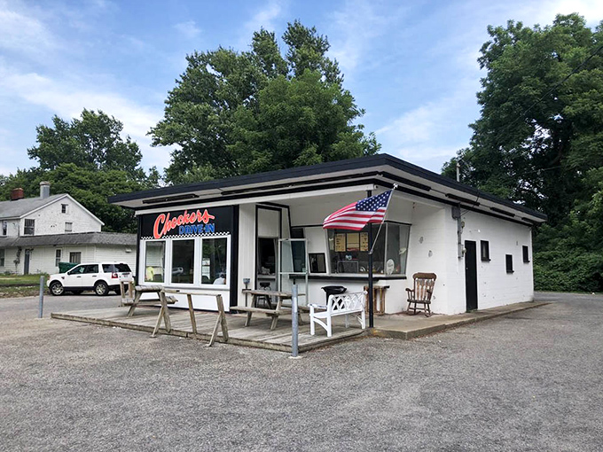 The American flag waves proudly beside this humble food landmark. Some places don't need to change to remain relevant.