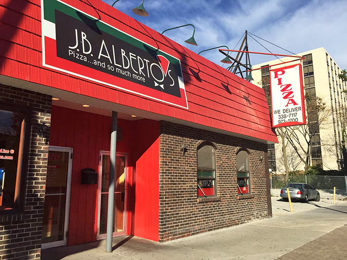 In daylight, J.B. Alberto's red exterior stands out like a cardinal against Chicago's urban landscape.