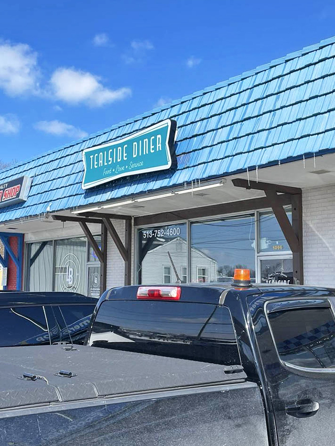 That blue roof isn't just eye-catching&mdash;it's a landmark that says, "Exit here, hungry traveler. Your breakfast salvation awaits."