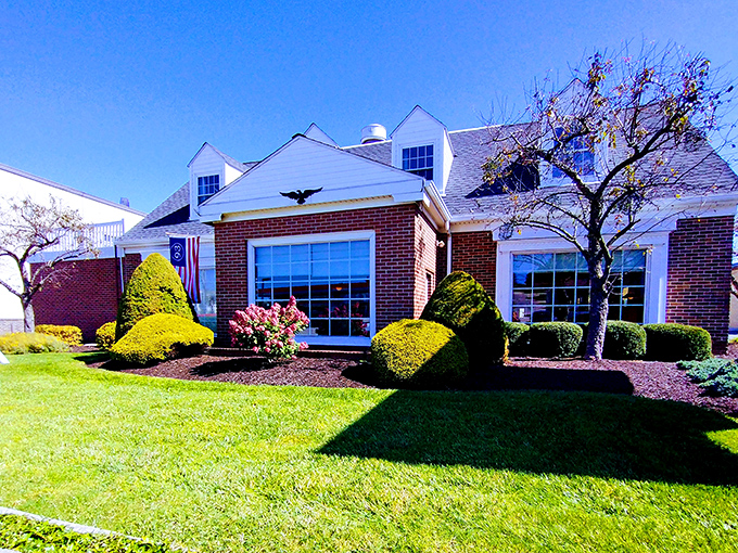 Spring sunshine highlights the manicured grounds—proving Pine Grill puts as much care into their exterior as their legendary steaks.