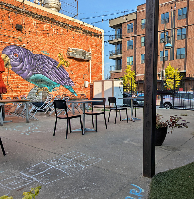 Outdoor seating with urban art backdrop&mdash;because sometimes your breakfast needs a side of street culture and fresh air.