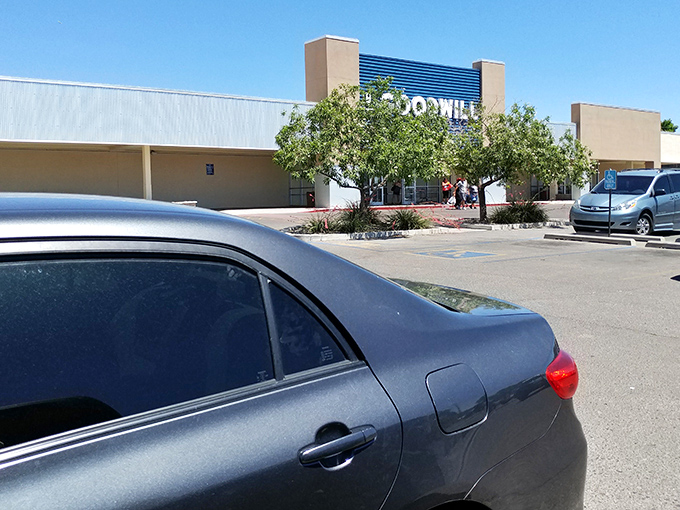 Even from the parking lot, the Goodwill sign promises an adventure in affordable retail therapy under the New Mexico sun.