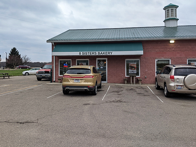 The parking lot &ndash; where vehicles gather like pilgrims at a shrine, their drivers united in pursuit of flaky, buttery enlightenment.