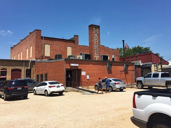 The gravel parking lot&mdash;first stop on your pilgrimage to meat nirvana. Those pickup trucks know something your sedan is about to learn.