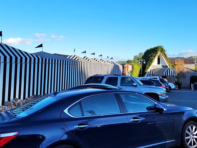 The black and white striped awnings stand like sentinels guarding culinary treasures within &ndash; a beacon for hungry travelers seeking seafood salvation.