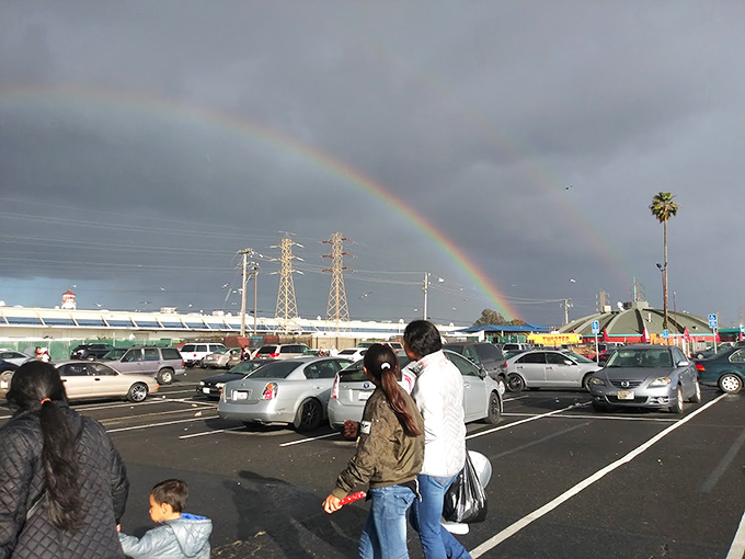 Even the weather celebrates bargain hunting with a perfect rainbow arching over the parking lot&mdash;nature's own "Open for Business" sign.