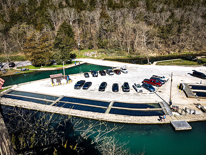 Where blue meets concrete &ndash; the park's hatchery pools and parking area offer a bird's-eye reminder that even paradise needs infrastructure.