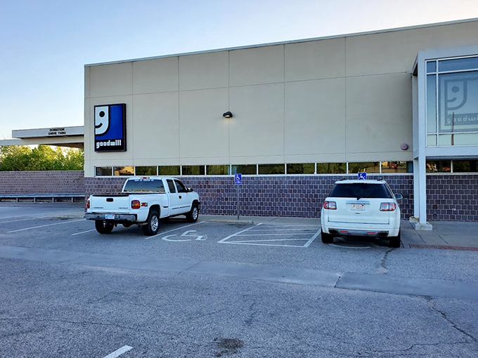 The parking area might be humble, but those spaces hold vehicles of savvy shoppers who understand the thrill of the thrift store expedition.