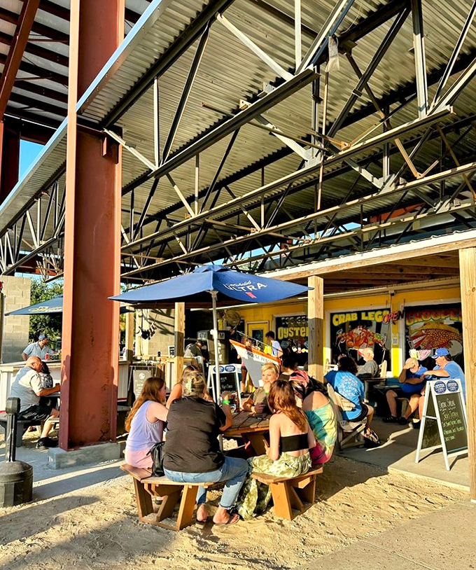 Outdoor seating under industrial beams creates the perfect casual atmosphere for seafood that deserves your full, undivided attention.