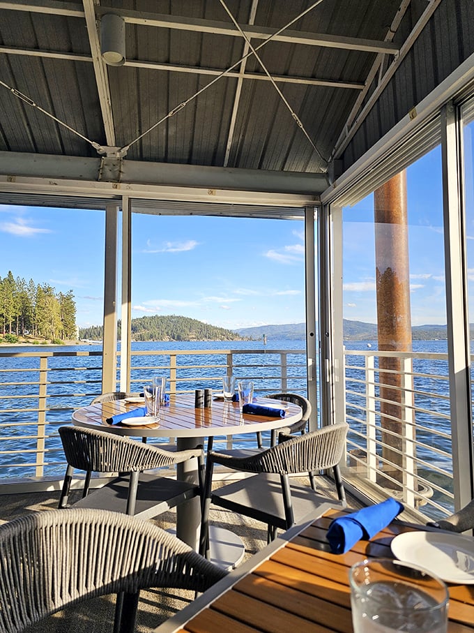 This waterfront table isn't just a seat&mdash;it's front-row tickets to nature's greatest show, with Lake Coeur d'Alene as the headliner.