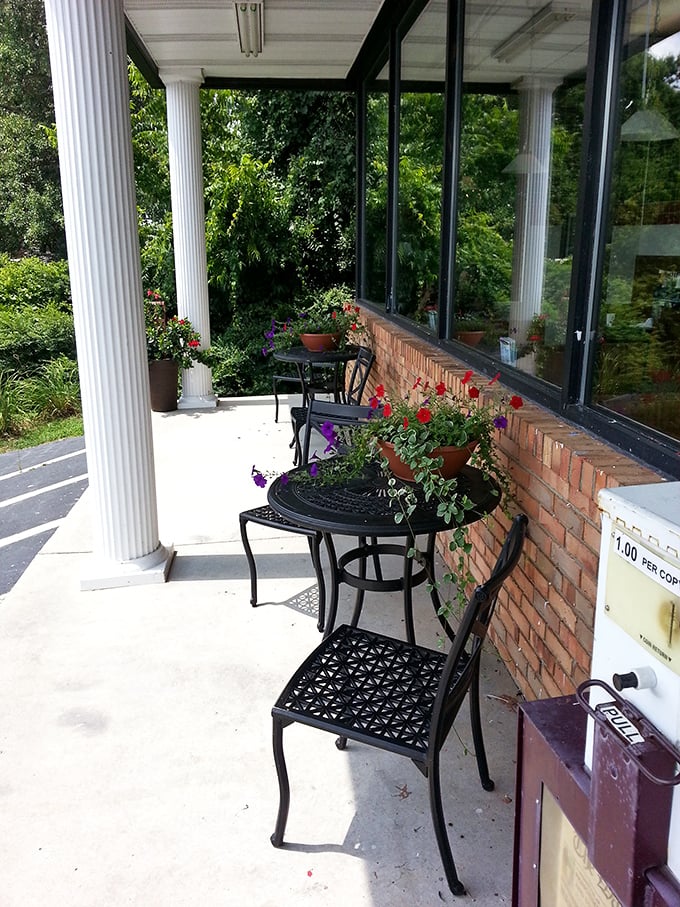 The secret garden patio where flowers bloom and coffee steam rises&mdash;a peaceful oasis for contemplating whether to order seconds.